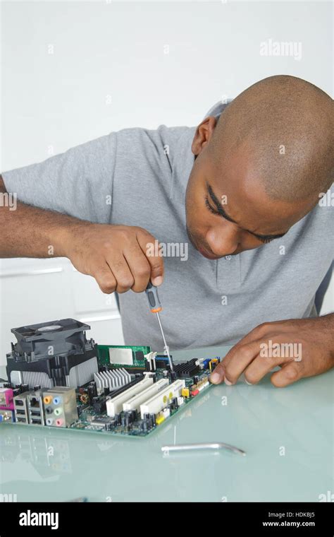 Fixing A Circuit Unit Stock Photo Alamy
