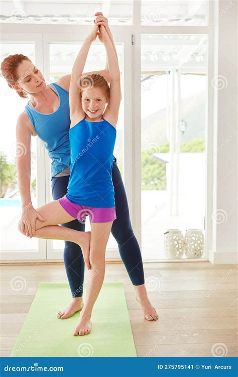 Mom Is The Best Yoga Teacher A Mother And Daughter Doing Yoga Together