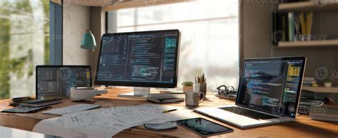 The Modern Workspace Featuring Multiple Screens For Coding And Design