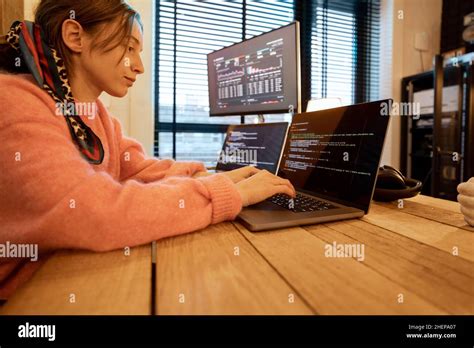 Female Programmer Writing Programming Code At Cozy Home Workplace Stock