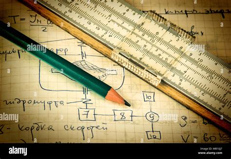 Pencil And A Slide Rule On The Old Page With The Calculations In Mechanics Stock Photo Alamy
