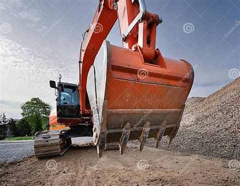 Backhoe Bucket Large Orange Backhoe Parked At A Construction Site