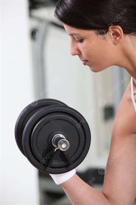 Woman Lifting A Dumbbell Photo Background And Picture For Free Download