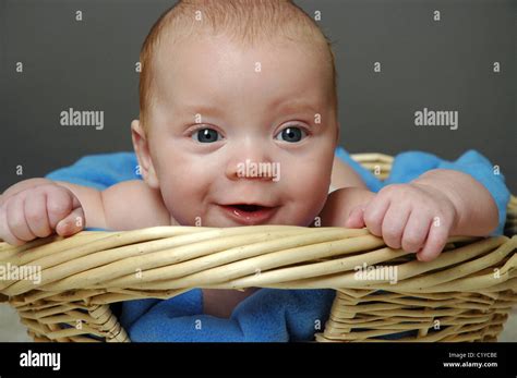 Cute Baby Boy Lying On Tummy In Wicker Laundry Basket He Is Four