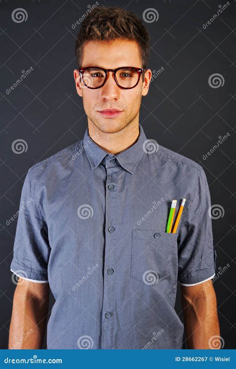 Portrait Of Funny Nerd Man With Pencyls And Glasses Over Black B Stock