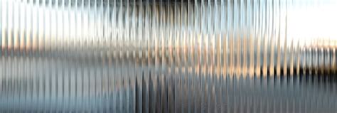 Sunset Colors Through Textured Reeded Glass With Reflection Premium