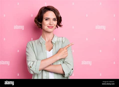 Portrait Of Attractive Cheery Content Girl Demonstrating Copy Blank Space Advert Isolated Over