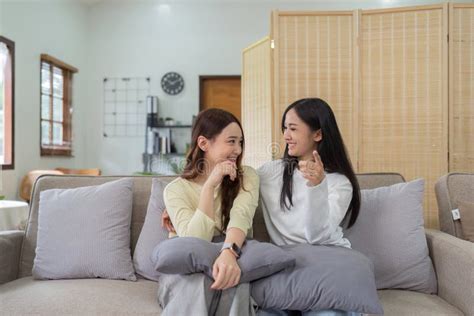 Lgbtqia Lesbian Gay Couple Sitting On Sofa And Enjoy To Watch Tv