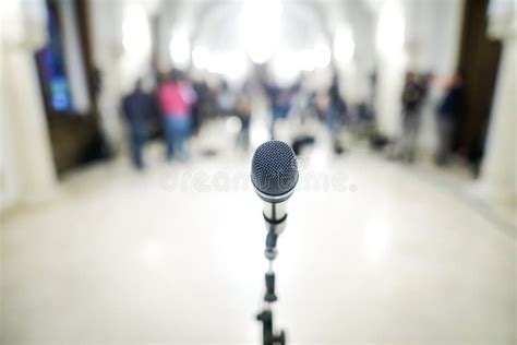 Shallow Depth Of Field Selective Focus Image With A Microphone In Front Of Tv Cameras During A