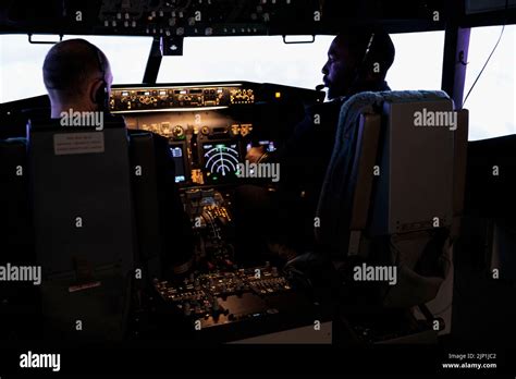 Captain And Pilot Flying Airplane With Engine Lever And Power Switch On Dashboard Command Using