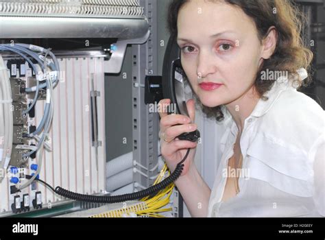 Woman Working On Technical Site Of Mobile Switching Center For Connection Cellular Phones Stock