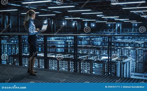 Data Center Female It Specialist Using Laptop Server Farm Cloud Computing And Cyber Security