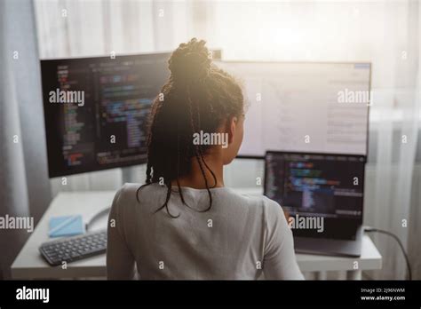 professional female programmer working on new project on computer at