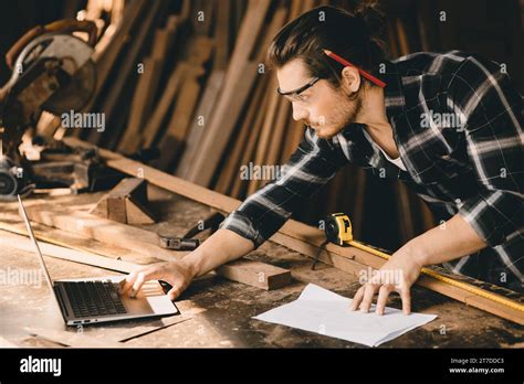 Carpenter Man Using Modern Technology Computer Laptop Software Aided Sketch Design New Wooden