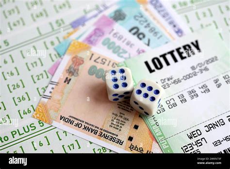 green lottery tickets and indian rupees money bills on blank with