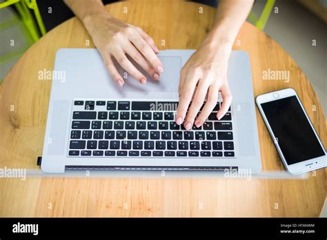 Female Hands Typing On Computer Keyboard And Phone Stock Photo Alamy