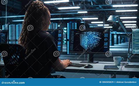 female software engineer working in a modern monitoring office with