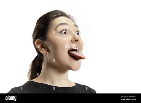 Smiling Girl Opening Her Mouth And Showing The Long Big Giant Tongue