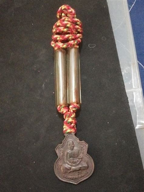 เหรียญหลวงพ่อฤทธิ์ หรือหลวงปู่ฤทธิ์ รุ่น 1 และตะกรุด 2 ดอก วัดชลประทานราชดําริ บุรีรัมย์ Ennxo