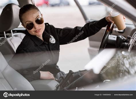 Attractive Policewoman Paper Cup Coffee Sitting Car Looking Camera