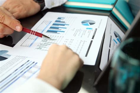 Premium Photo Business Project Team Working Together And Discussing Data On A Graph At The Office