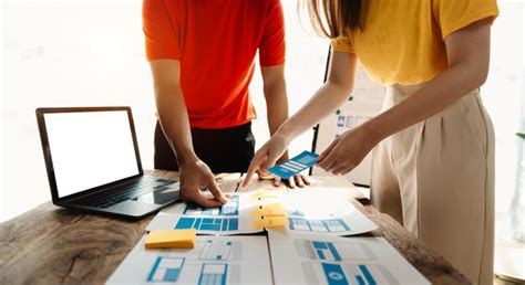 premium photo close up view of ui developer team brainstorming on