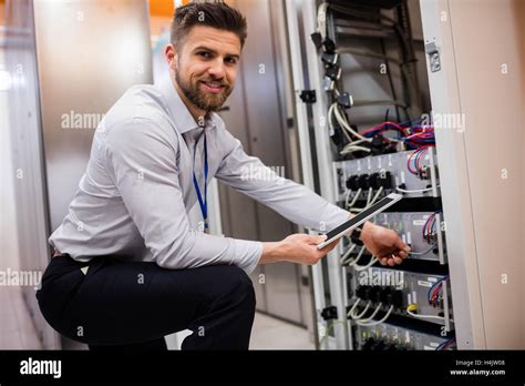 Technician Using Digital Tablet While Analyzing Server Stock Photo Alamy