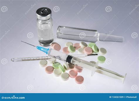 Antibiotic Injection Bottles With A Plastic Disposable Syringe On A White Background Royalty