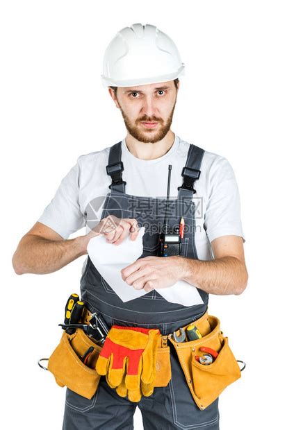 一名建筑工或戴防护头盔的工人违反他面前的合同高清图片下载 正版图片505285886 摄图网