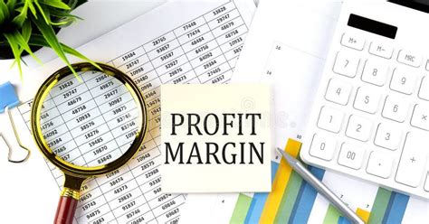 PROFIT MARGIN Text On Sticker On Diagram With Magnifier And Calculator Business Concept Stock