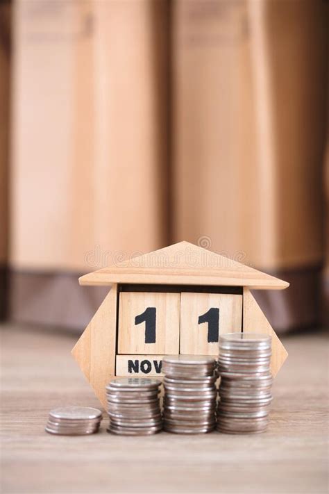 Cute Little Desk Calendar Showing The Number 11 And Incrementing Dollar