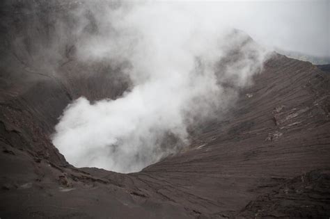 Premium Photo Smoke Erupting From A Volcano