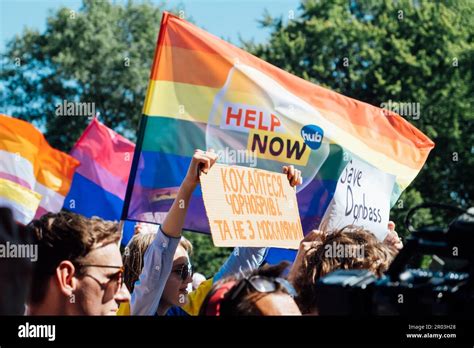 Gay Pride Lgbtq Solidarity March With Rainbow Flags And Antiwar