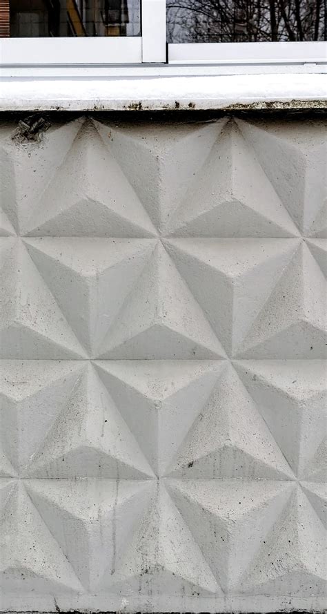 pattern on the concrete panel forms stone face r pareidolia