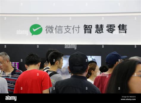 file poeple visit the stand of the messaging app weixin or wechat