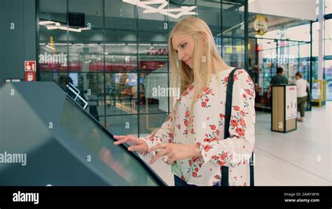 Woman Near Navigation Board In Mall Side View Of Lovely Young Female In Casual Outfit Looking