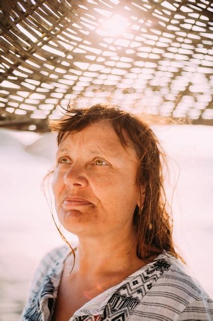 Premium Photo Mature Woman Looking Away Outdoors