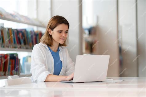 Premium Photo Young Copywriter Typing Keyboard Working Freelance Project At Workplace Smiling