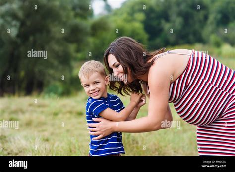 Happy Pregnant Mom And Her Son Stock Photo Alamy