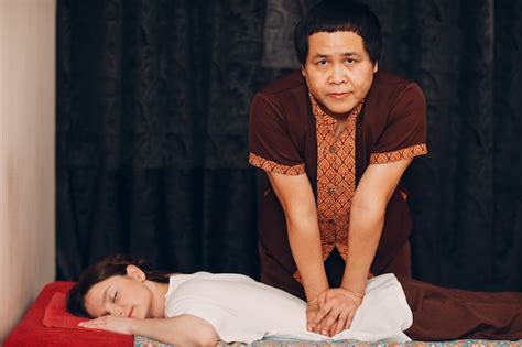 Premium Photo Thai Man Making Classical Thai Massage Procedure To