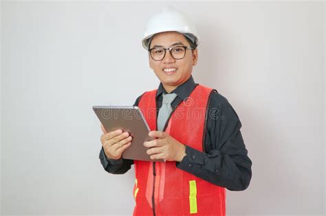 Confident Asian Engineer Man Using Tablet For Checking And Maintenance To Inspection At Modern
