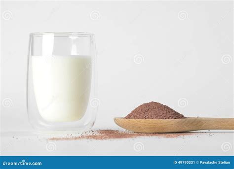Cocoa Powder In Wooden Spoon And Glass Of Milk Stock Image Image Of