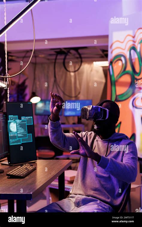 Hacker Wearing Vr Helmet Doing Illegal Activities And Breaching Online Security Systems In
