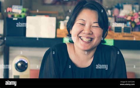 Asia Women 40s White Skin In Black Dress Have A Laughing Smile Gesture