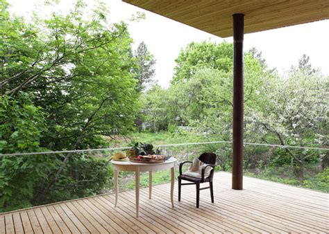 Timber House M M By Tuomas Siitonen Wraps Around A Sheltered Garden