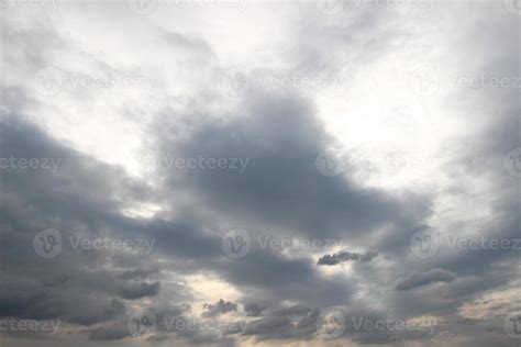Sunset Sky Above Heavy Dark Clouds Almost Raining With Dramatic Rays Of