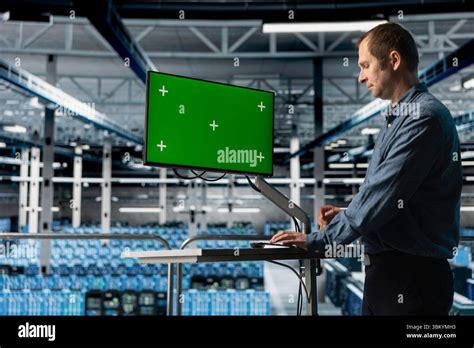 Data Center Admin Using Green Screen Pc To Do Programming Optimizing