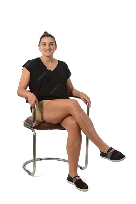 Full Portrat Of A Woman Sitting On Chair Legs Crossed On White