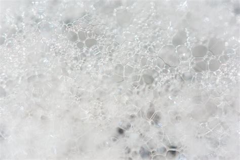 Premium Photo Soap Bubbles Washing Powder Flowing Close Up