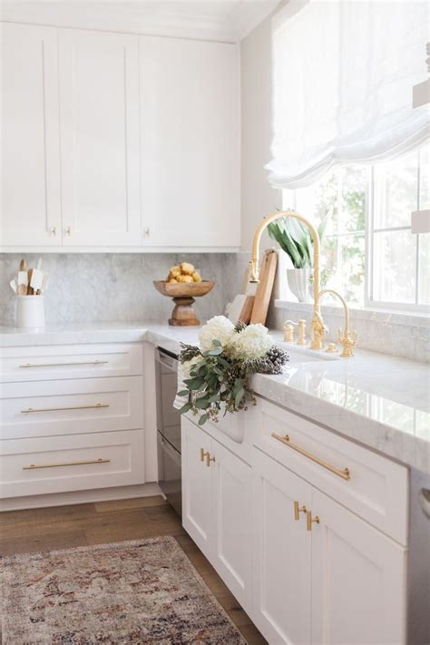 Elegant White Kitchen With Brushed Gold Hardware